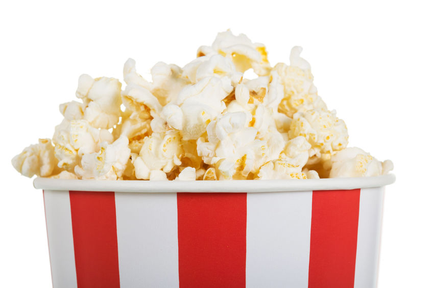 Salty, delicious popcorn in box, isolated on white. | Tip Top Tents